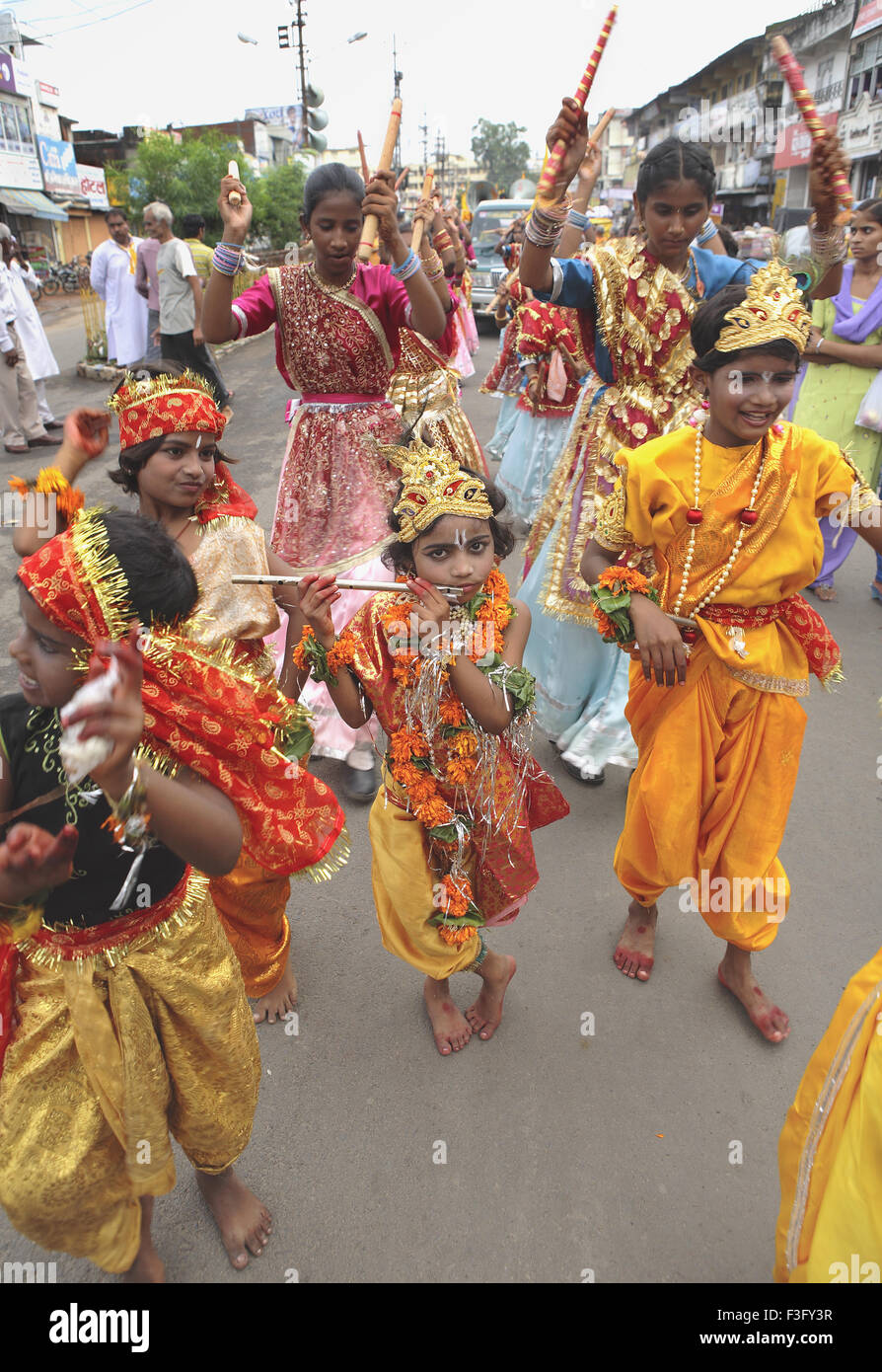 Janmashtami festival Lord Krishna birthday celebration carnival procession musical band children ...