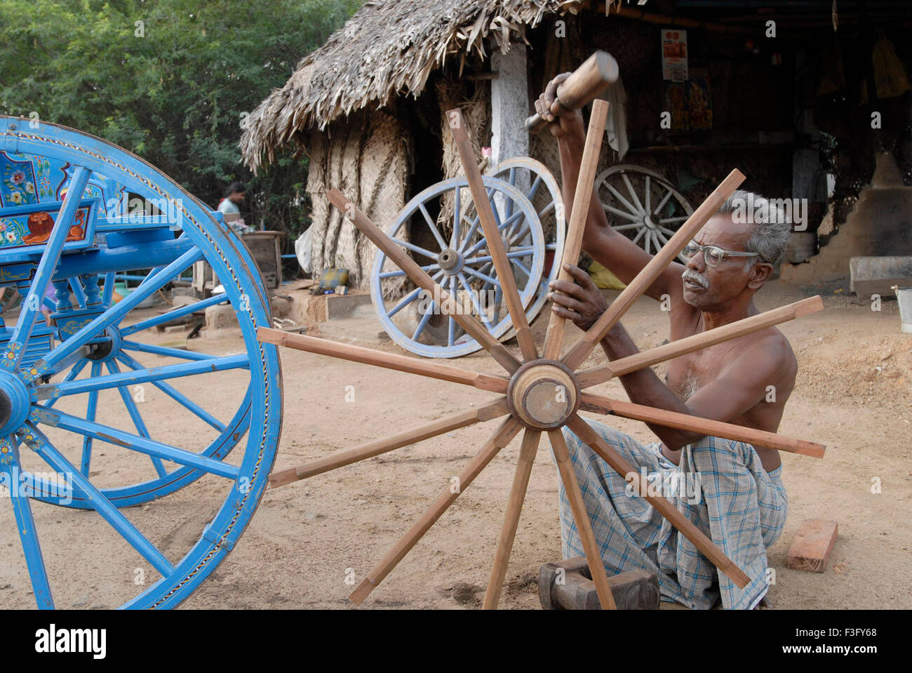 Carpenter shaping bullock cart wheel, Kerala, India, Asia Stock Photo ...