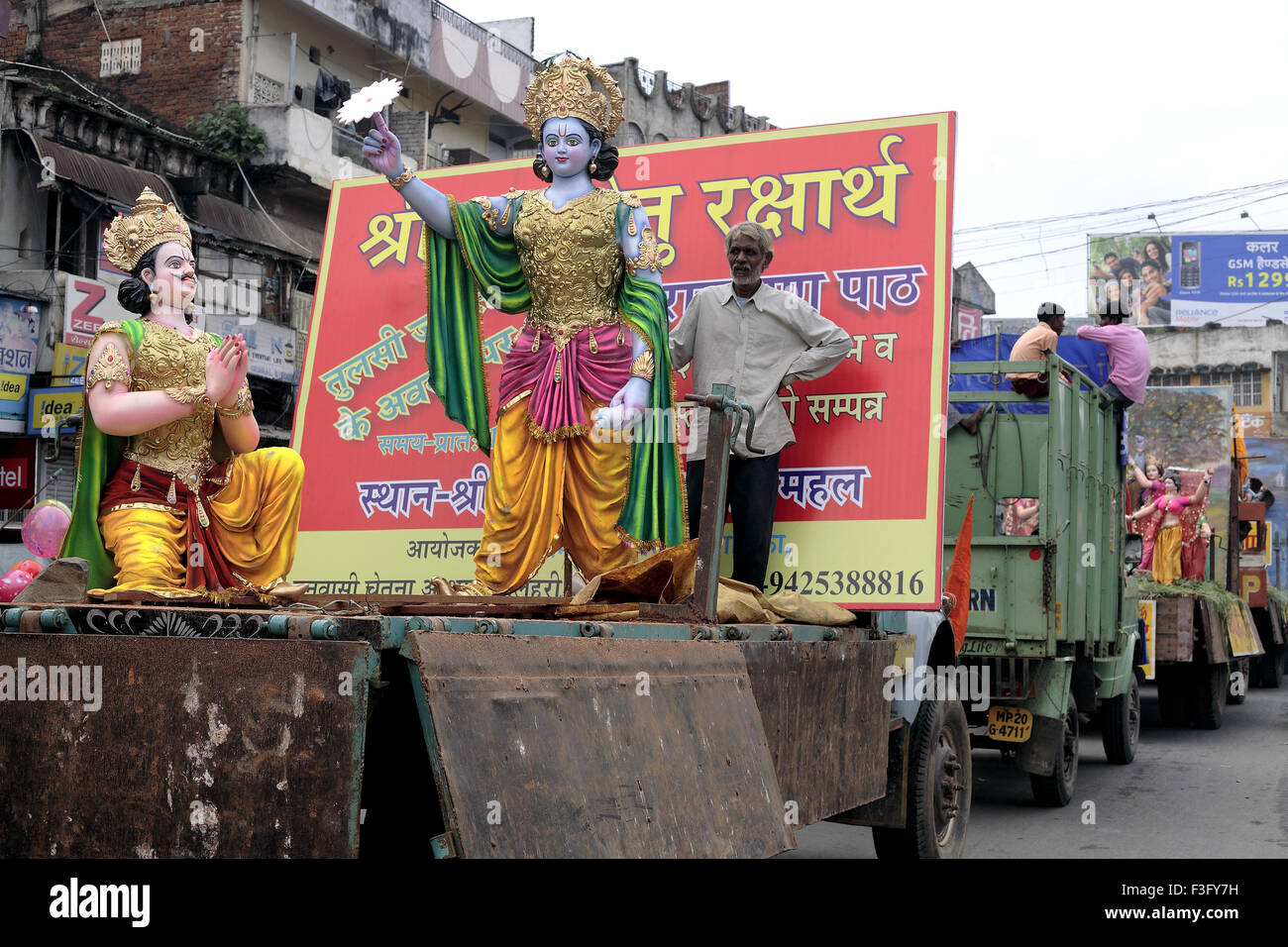 Janmashtami festival Lord Krishna birthday celebration carnival procession clay idols Krishna ...