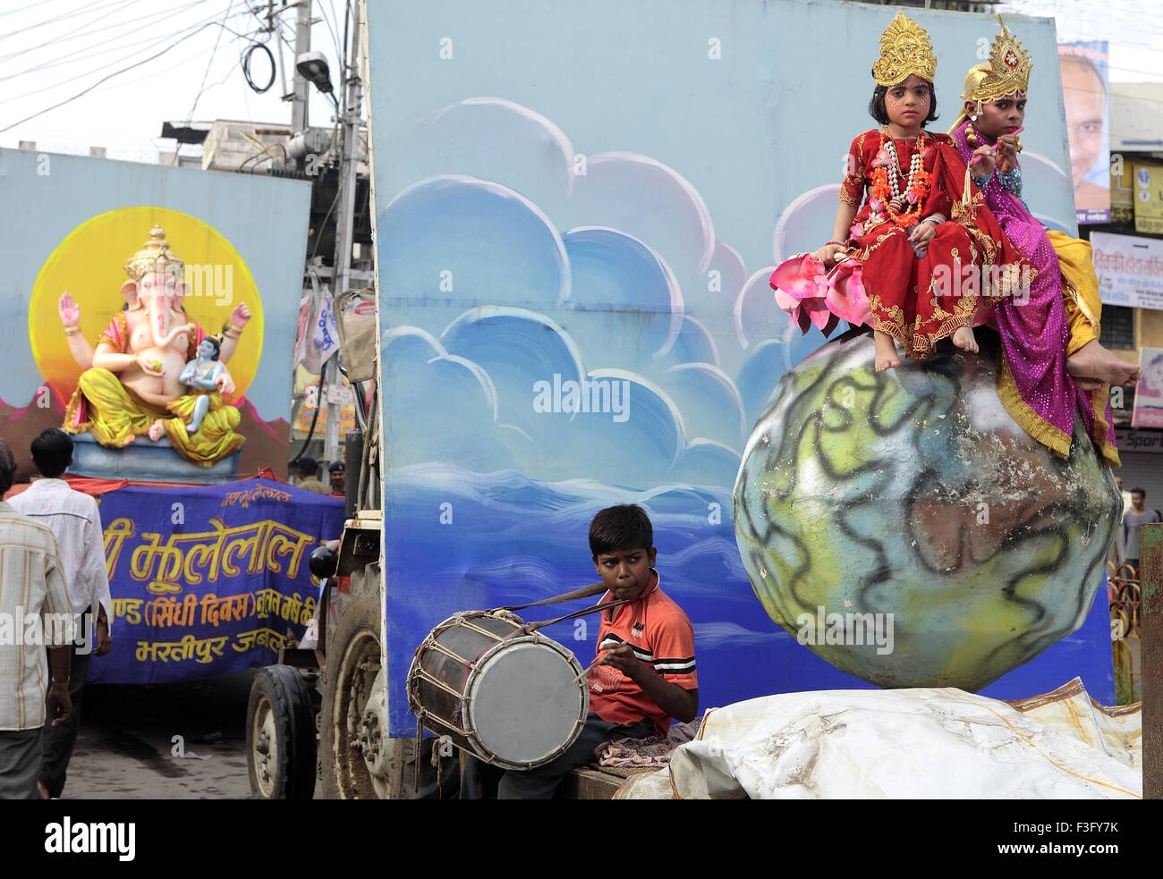 Janmashtami festival Lord Krishna birthday celebration carnival children Krishna Radha sitting ...