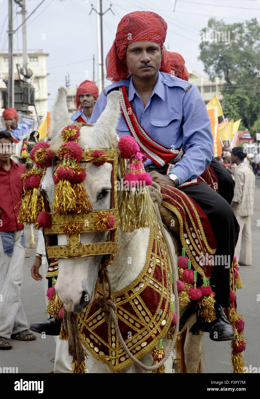 Janmashtami festival Lord Krishna birthday celebration carnival men turbans mounted decorated ...