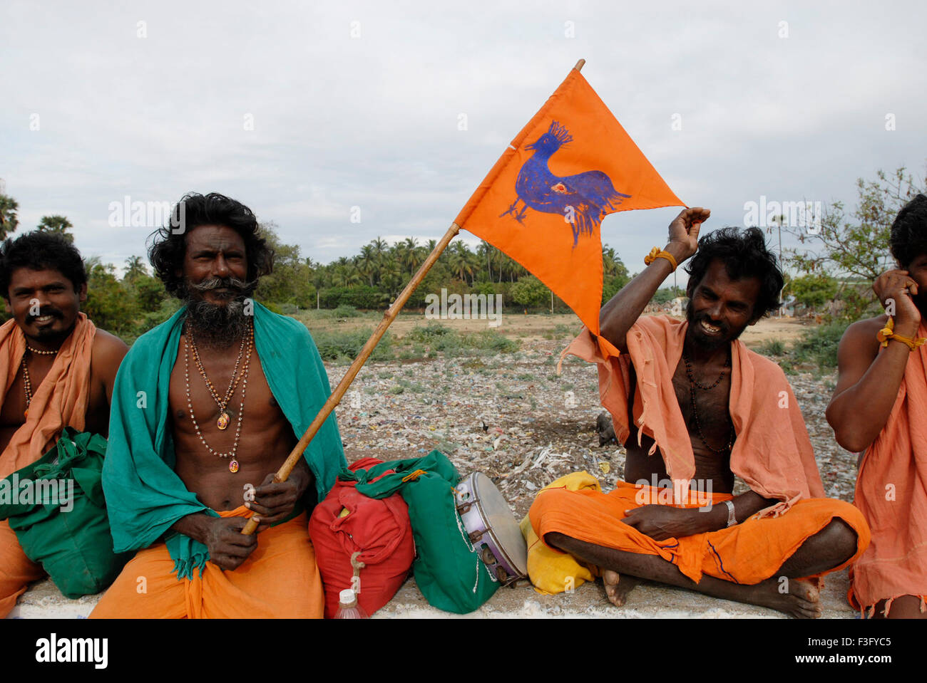 Pada yatra or foot pilgrimage holding flag with cock emblem during ...
