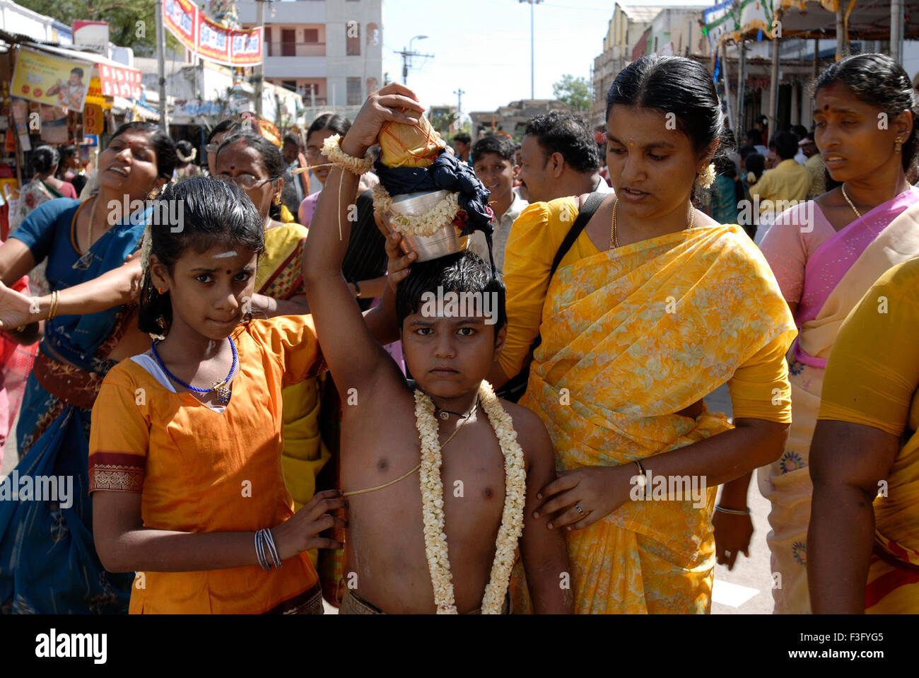 Boy carrying milk pot Paal kudam for abhishekam ; Tirupparankundram ...