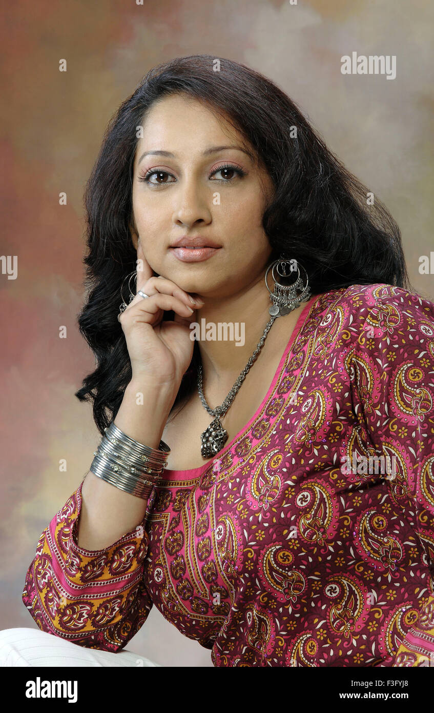 Portrait of woman posing hand on cheek MR#732B Stock Photo - Alamy