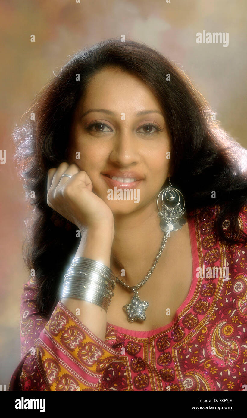 Portrait of woman posing hand on cheek MR#732B Stock Photo - Alamy