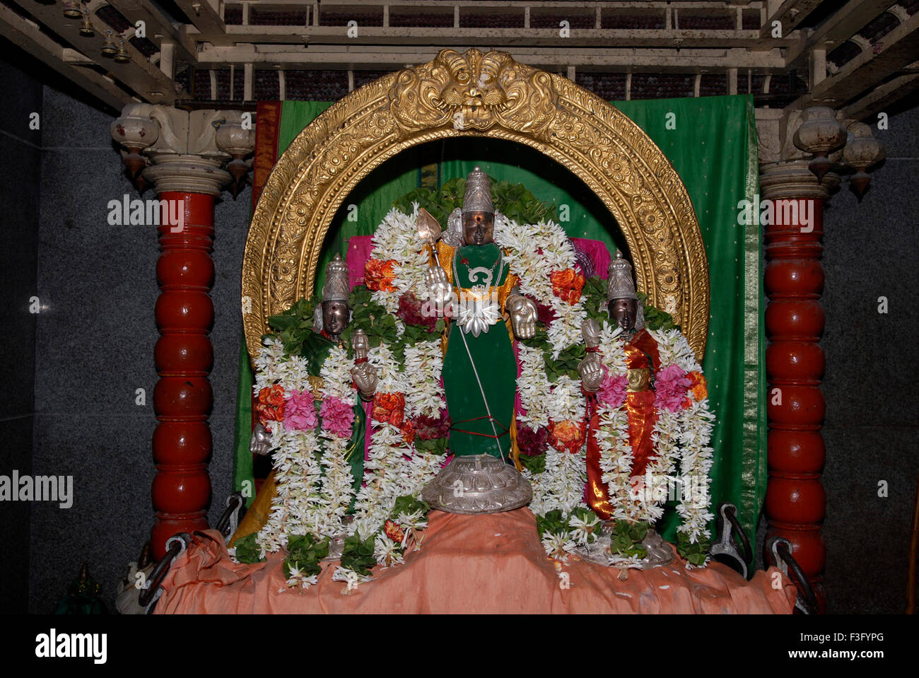 Decorated Urchava deity of lord Subrahmanya with consorts Valli and ...