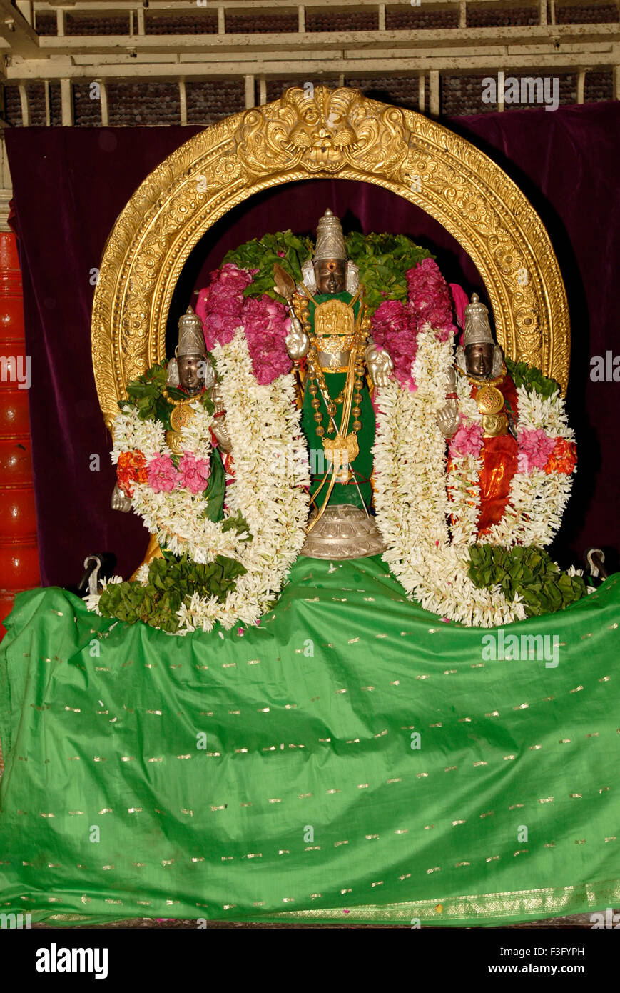 Decorated Urchava deity of lord Subrahmanya with consorts Valli and ...
