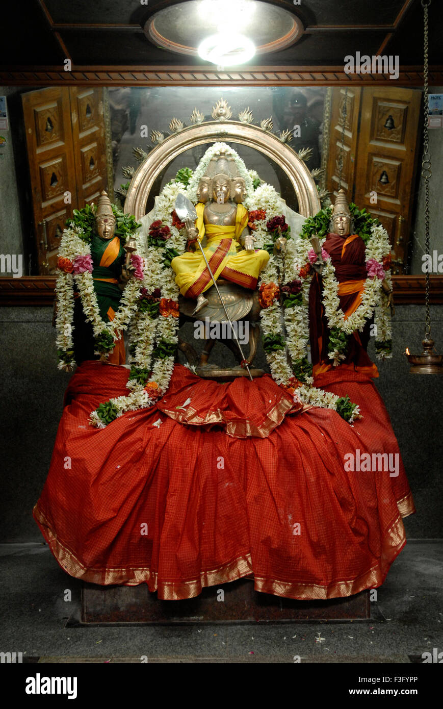 Shanmugar with consorts Valli and Deivanai (Devasena) inside temple ...