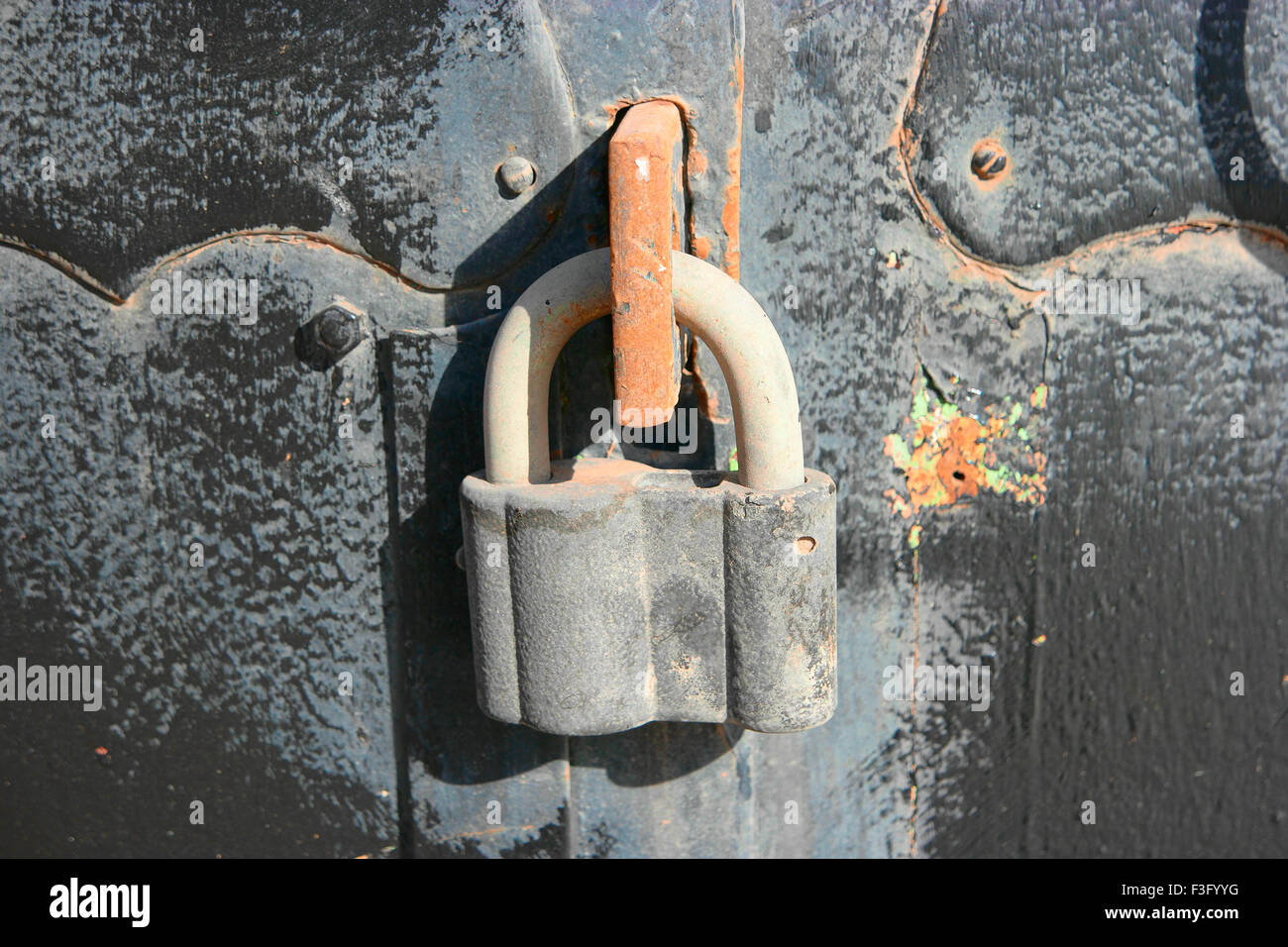 Metal lock on iron door closeup Stock Photo - Alamy