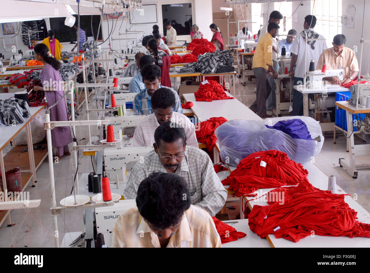 Stitching In A Garment Industry Tirupur Tamil Nadu India Stock stitching-in-a-garment-industry-tirupur-tamil-nadu-india-stock
