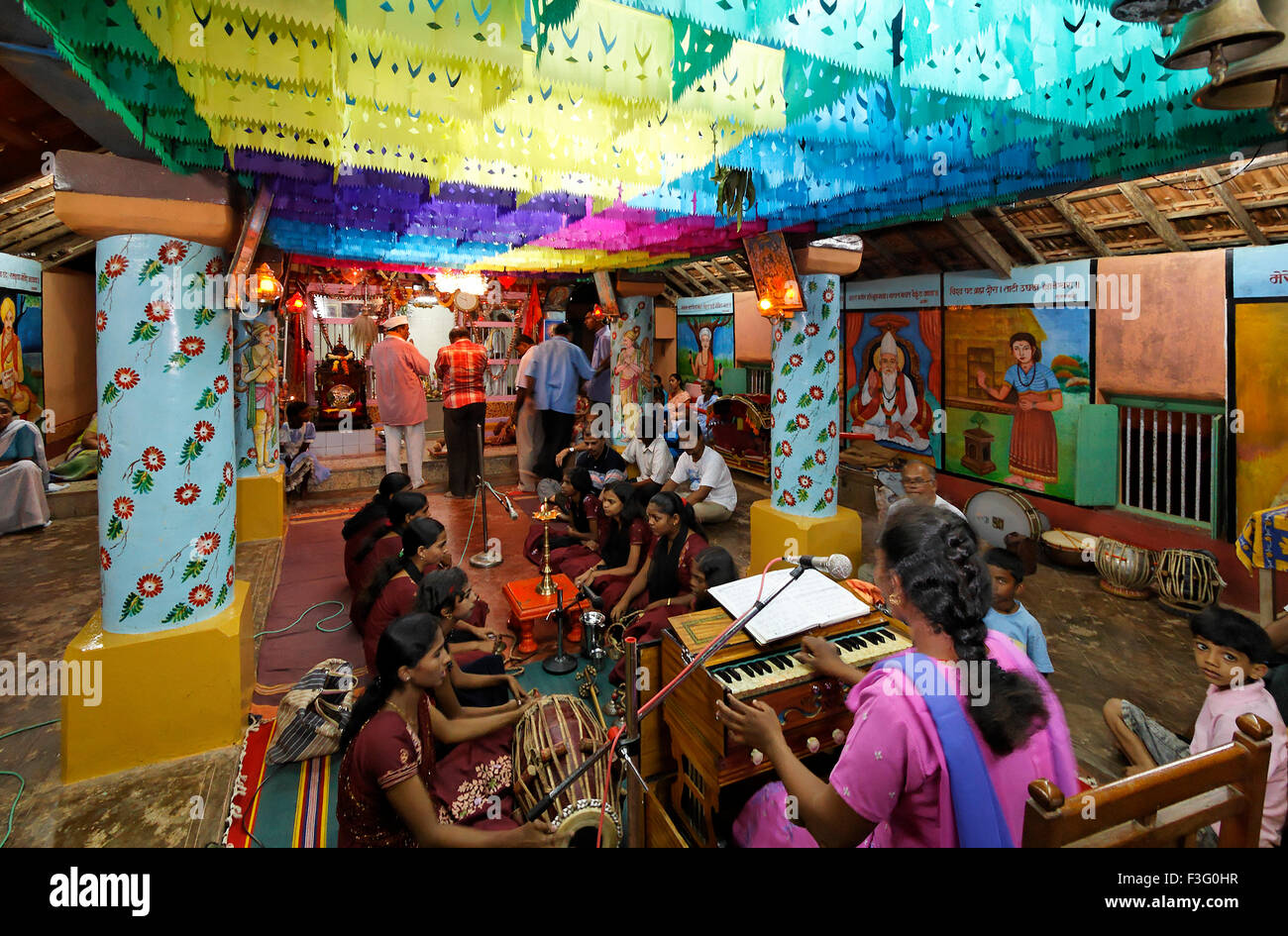 Girls singing bhajan playing musical instruments harmonium tabla in ...
