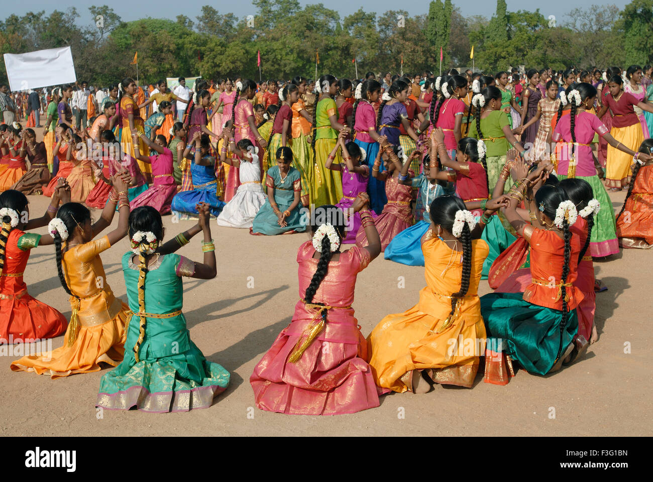 Children performing group dances in festive program ; Kerala ; India ...