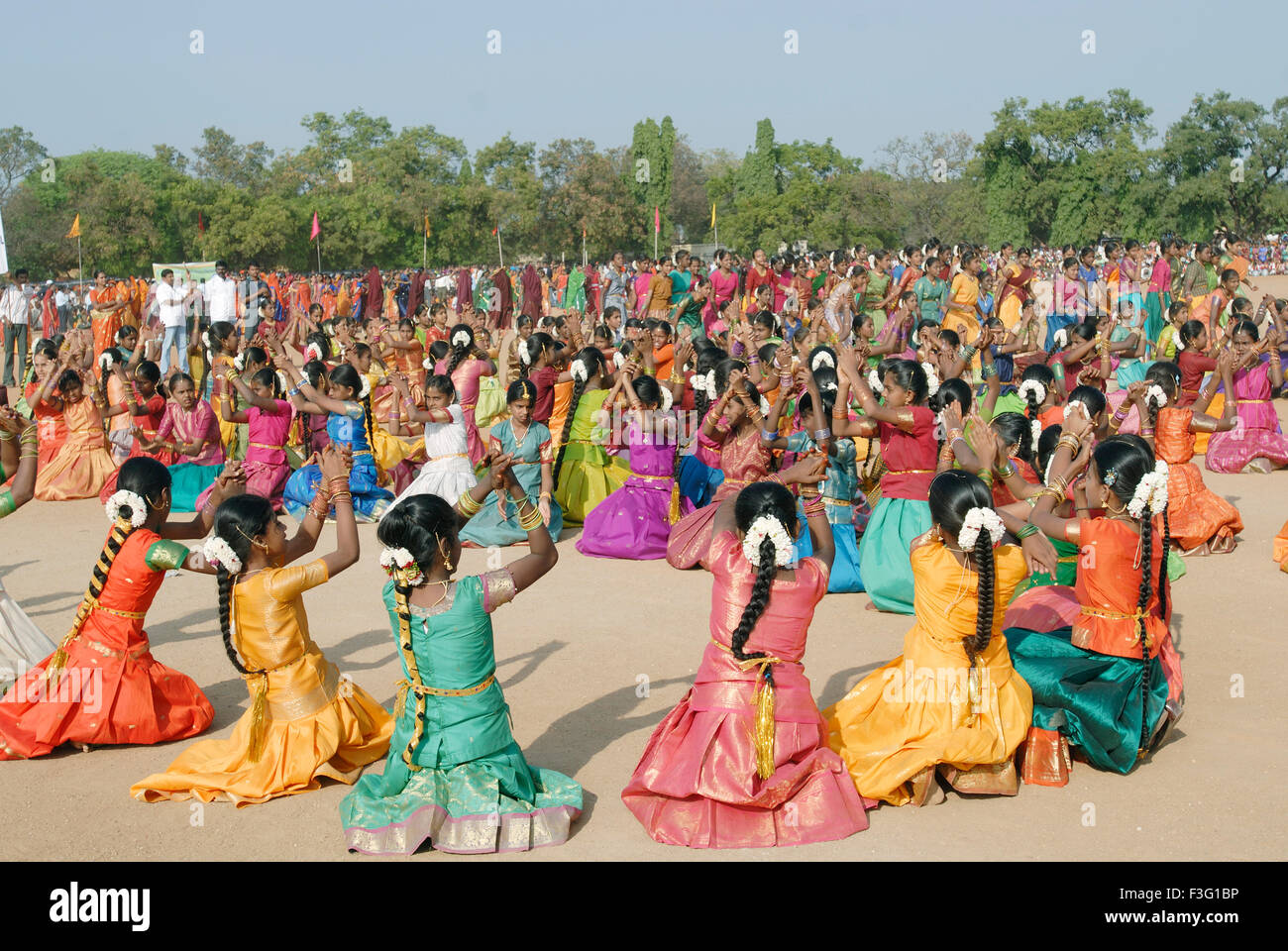 Children performing group dances in festive program ; Kerala ; India ...