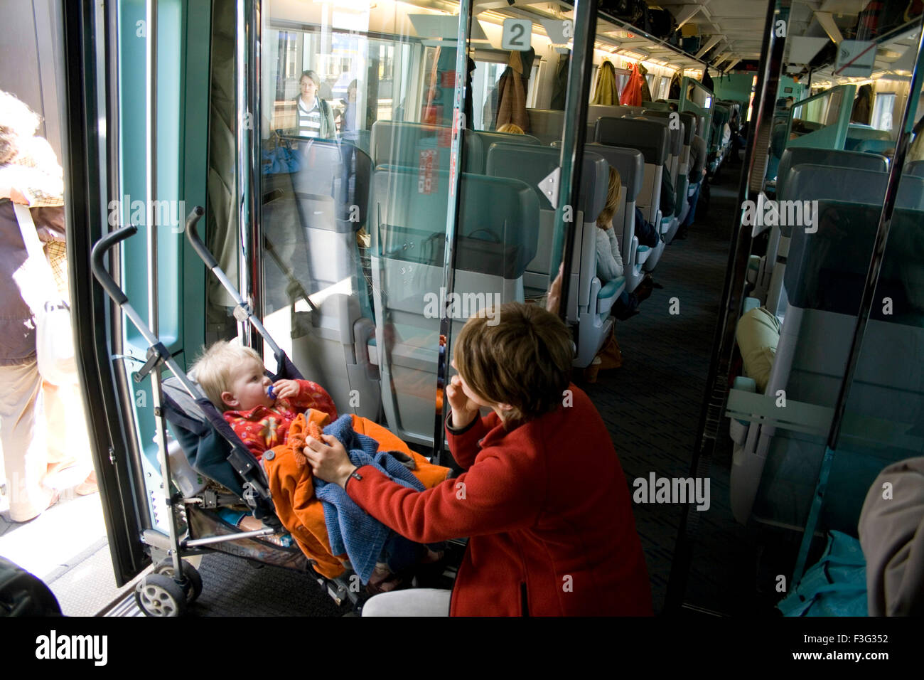 Mother and child in pram inside train ; Germany ; Europe Stock Photo ...