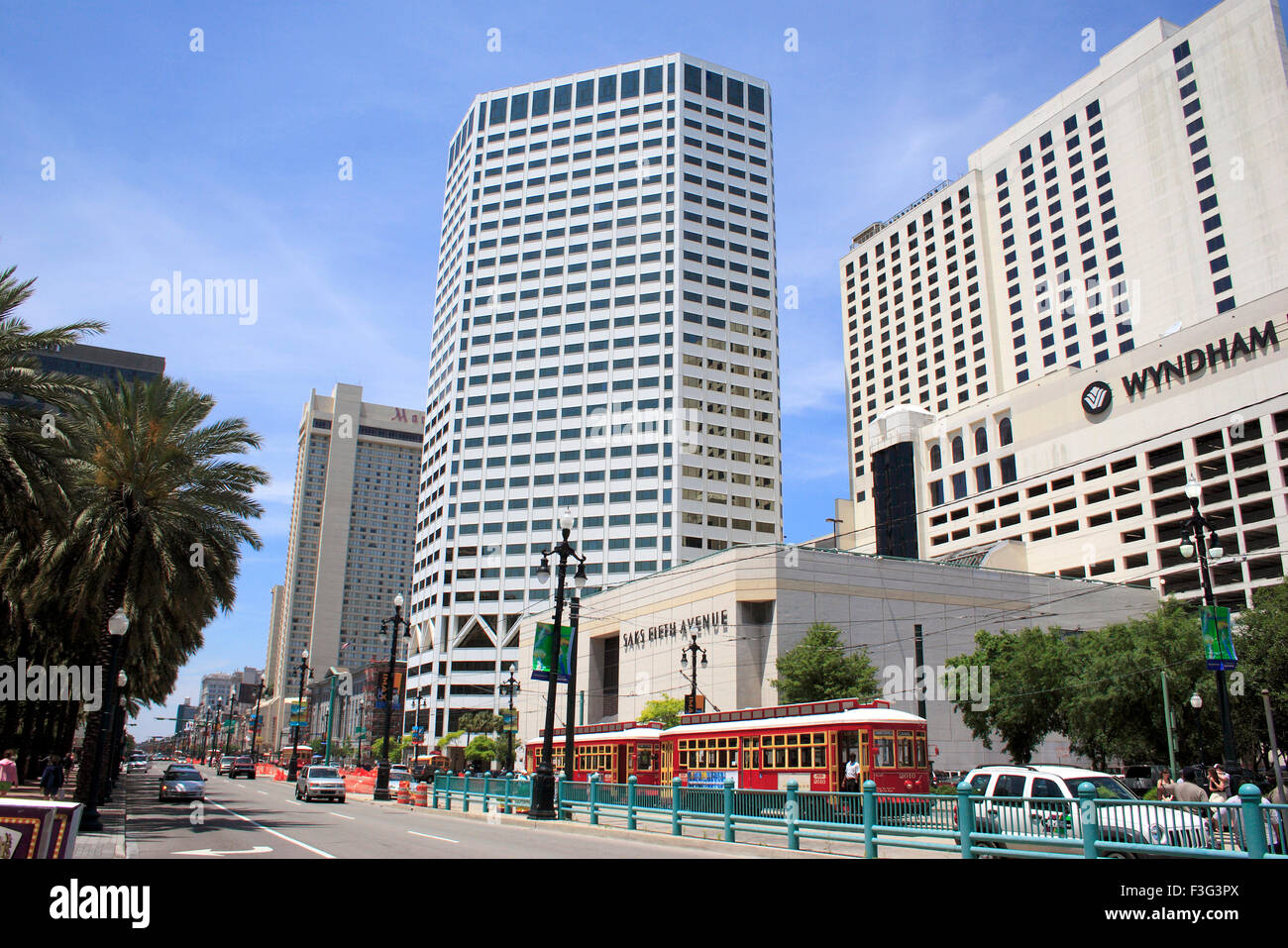 Public transportation ; canal street ; high rise buildings; New Orleans ...