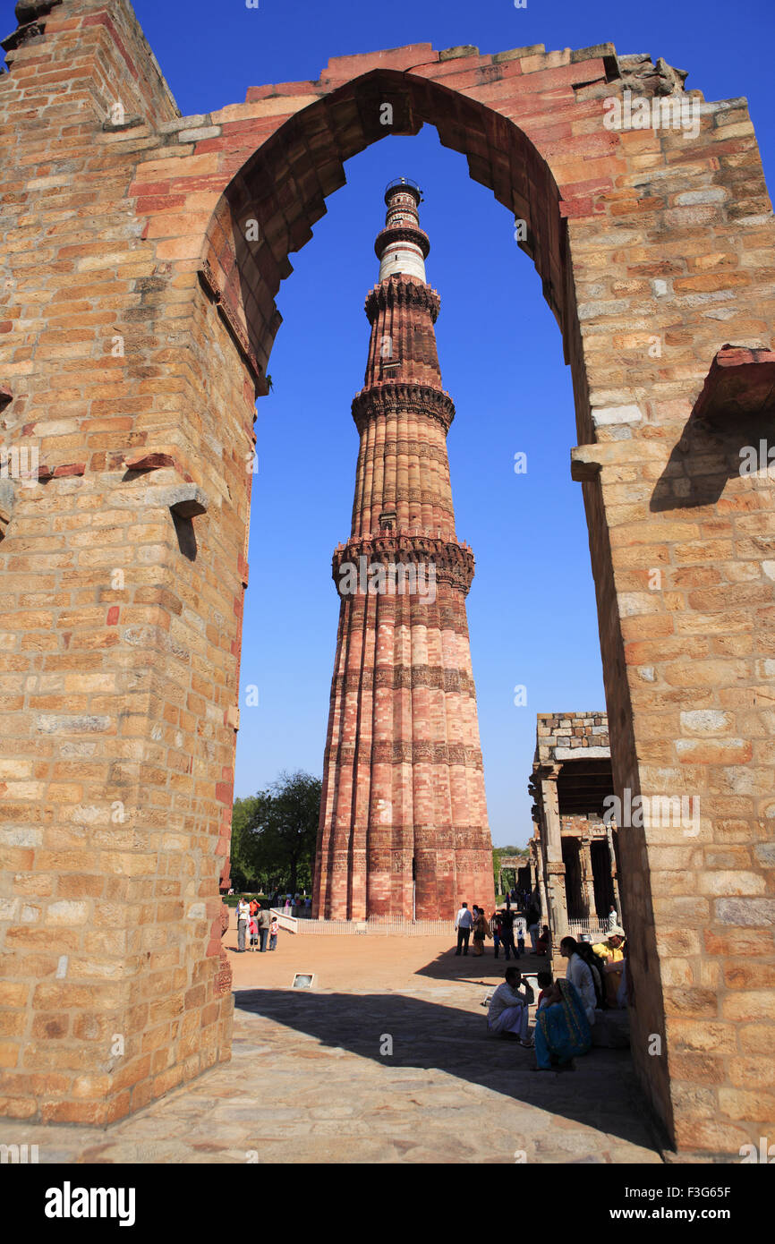 Qutb Minar through arch built in 1311 red sandstone tower ; Indo Muslim ...