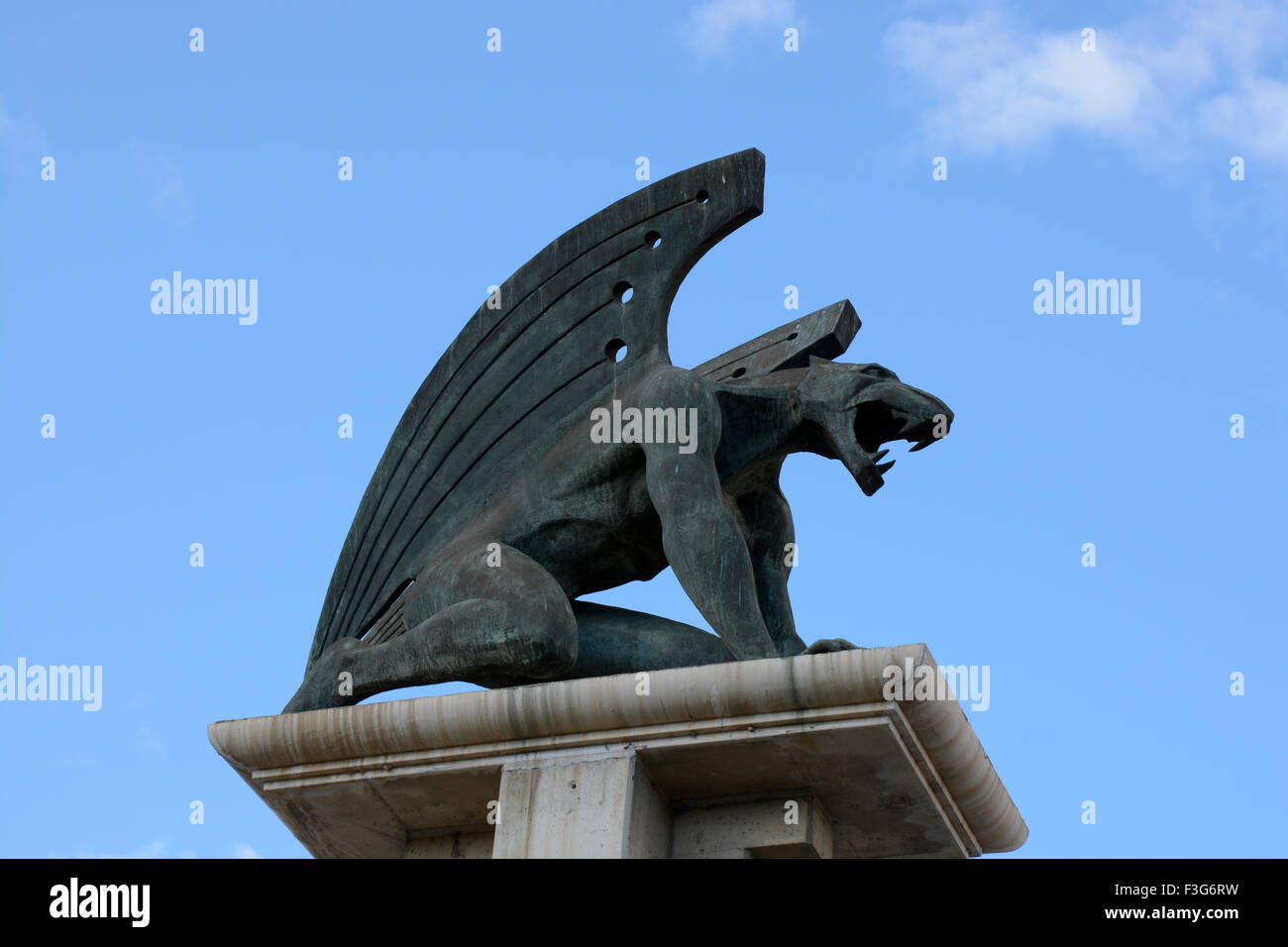 Sculpture of mythical winged creature on Aragon bridge over the Turia ...