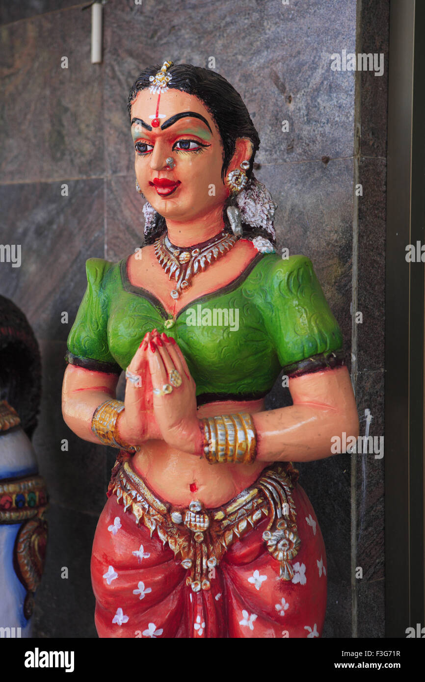 Lady in namaste pose at entrance of hotel ; District Shivgangai ; Tamil ...