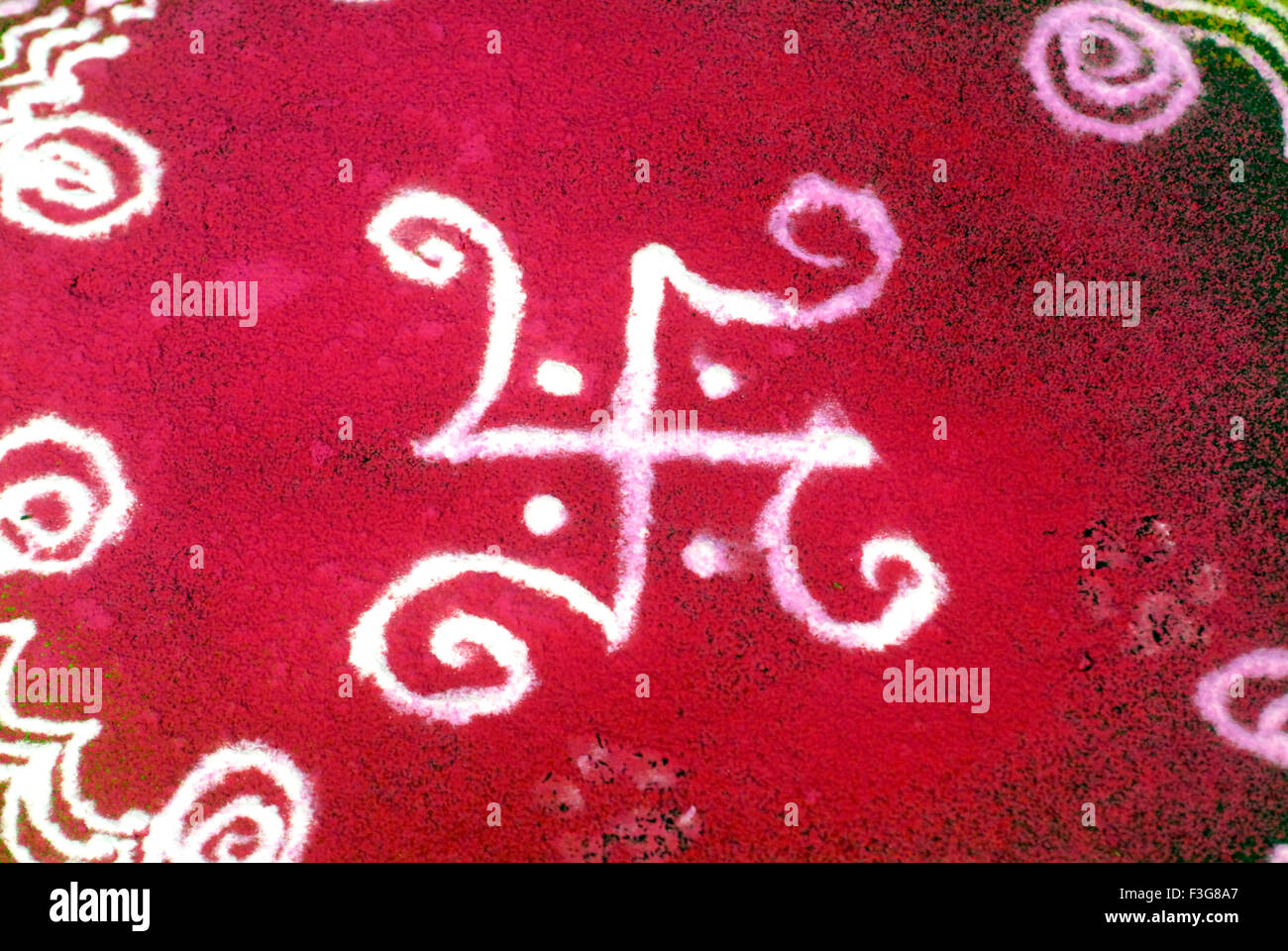 Swastika symbol of sun god colourful rangoli designs drawn with ...