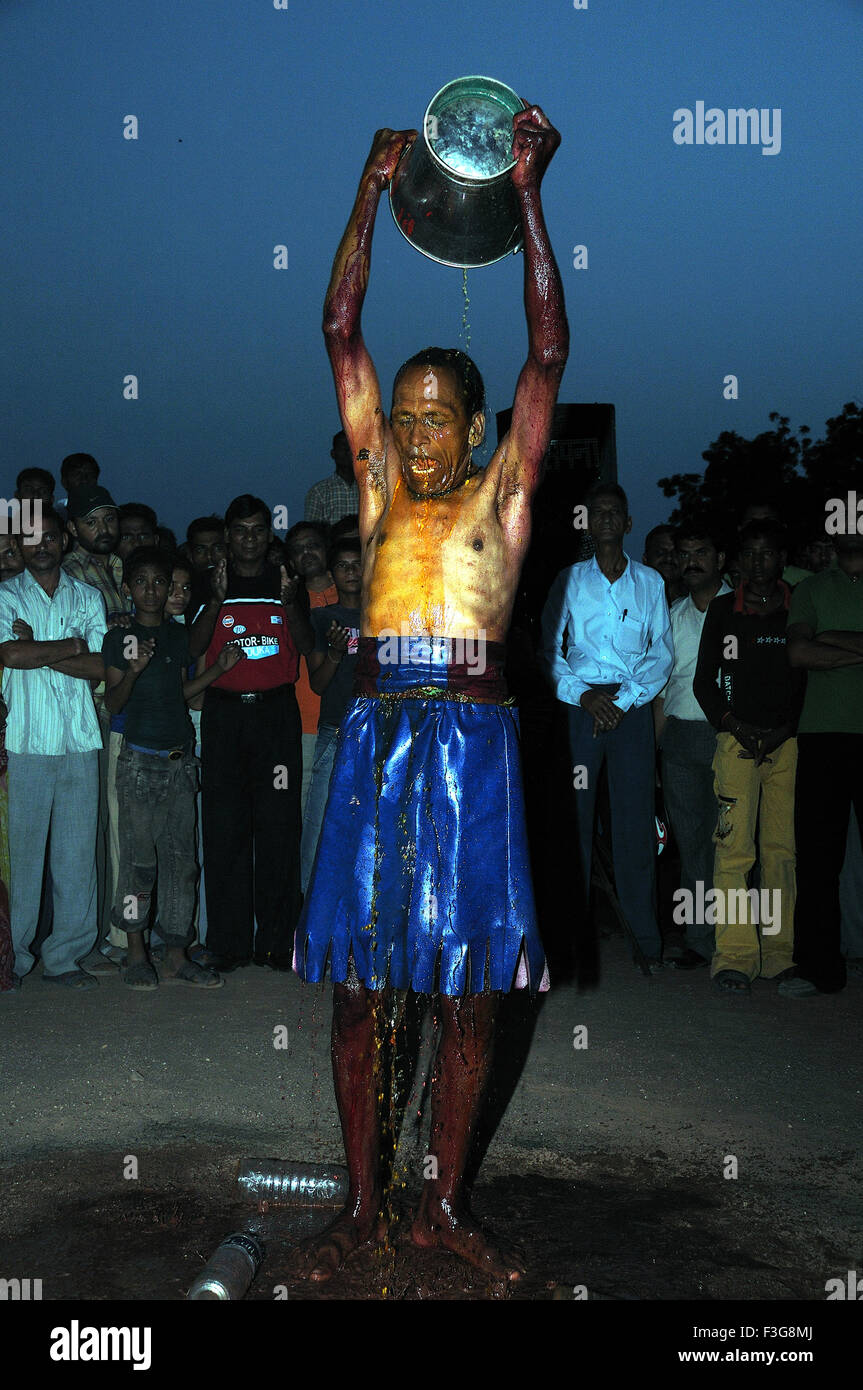 Man putting acid on his body ; Jodhpur ; Rajasthan ; India Stock Photo ...