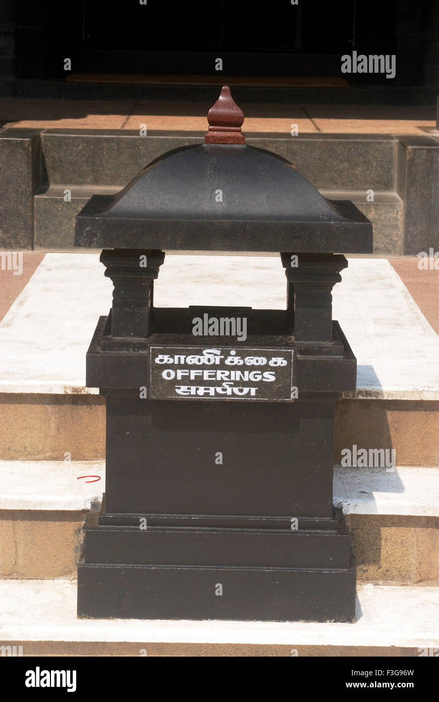 Richly decorated offering box in front of Shripada Mandapam at ...