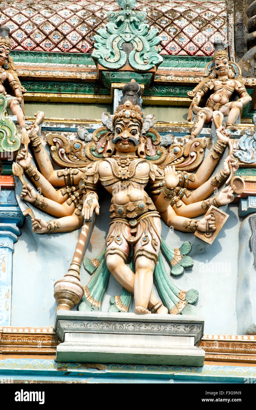 Richly decorated colourfully painted stucco figure west gopuram of ...