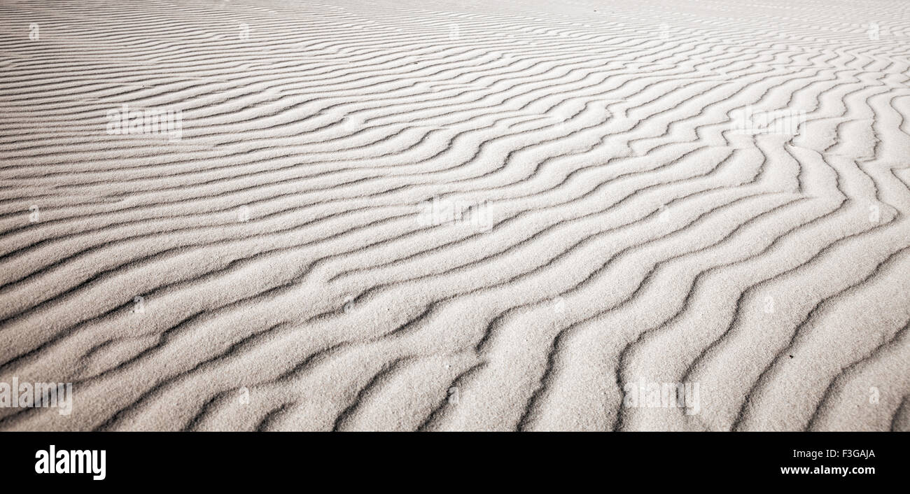 sand and wind pattern on dune surface natural background Stock Photo ...