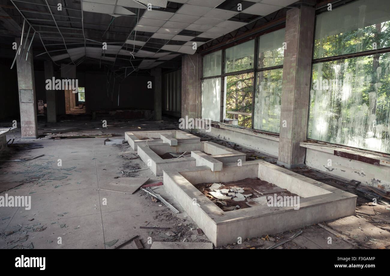 Abandoned building interior. Corridor perspective with broken ceiling ...