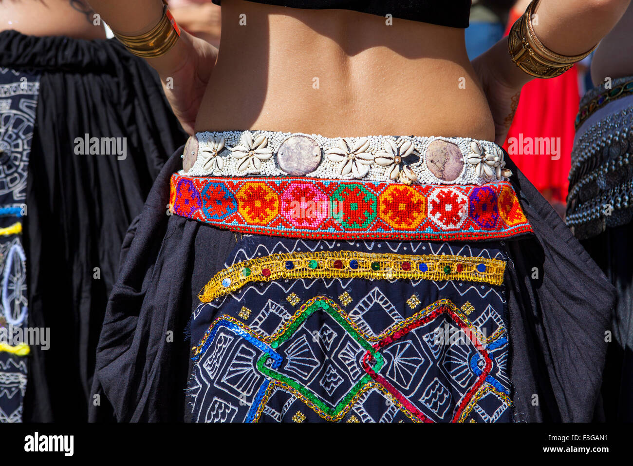 Belly dancer back with colored skirt full of decoratives details Stock ...