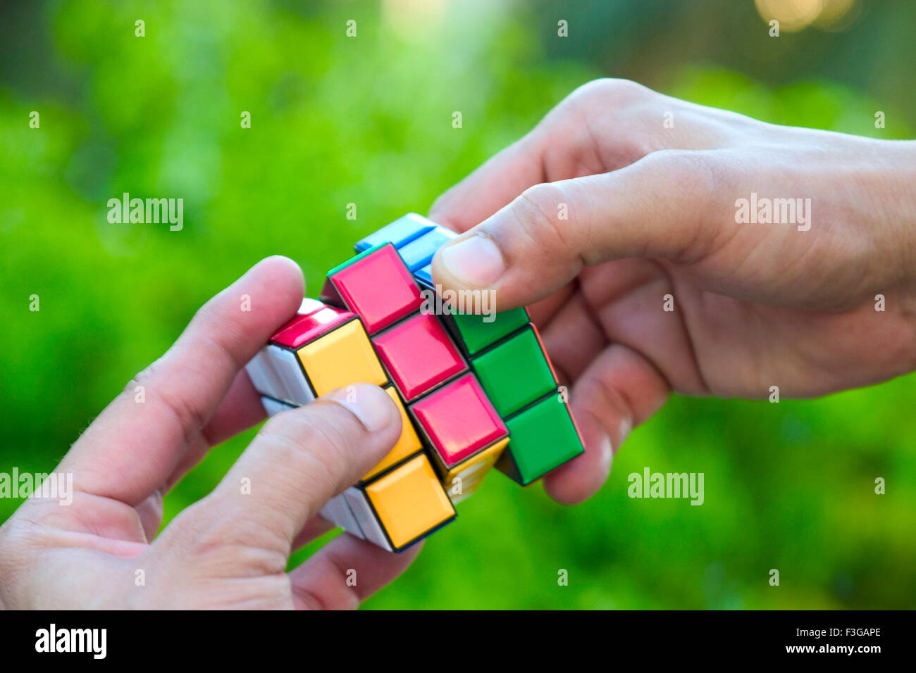 Concept ; Hand playing with Rubik puzzle cube game MR#201 Stock Photo ...