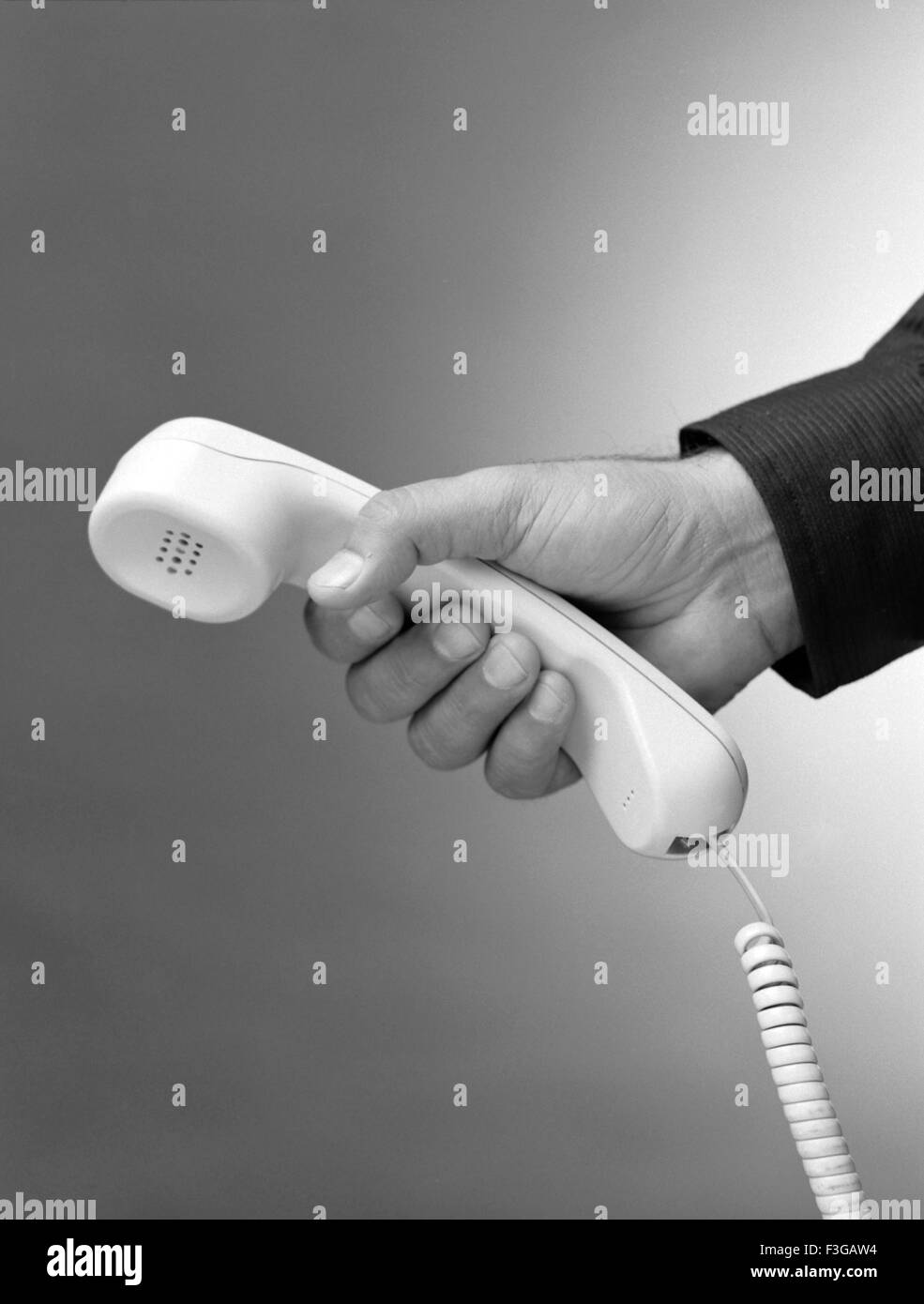 Hand holding telephone Stock Photo - Alamy