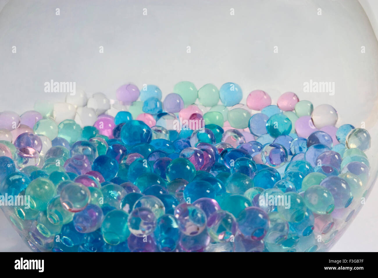 Showpiece lot of Colorful gel ball in big round glass jar on white ...