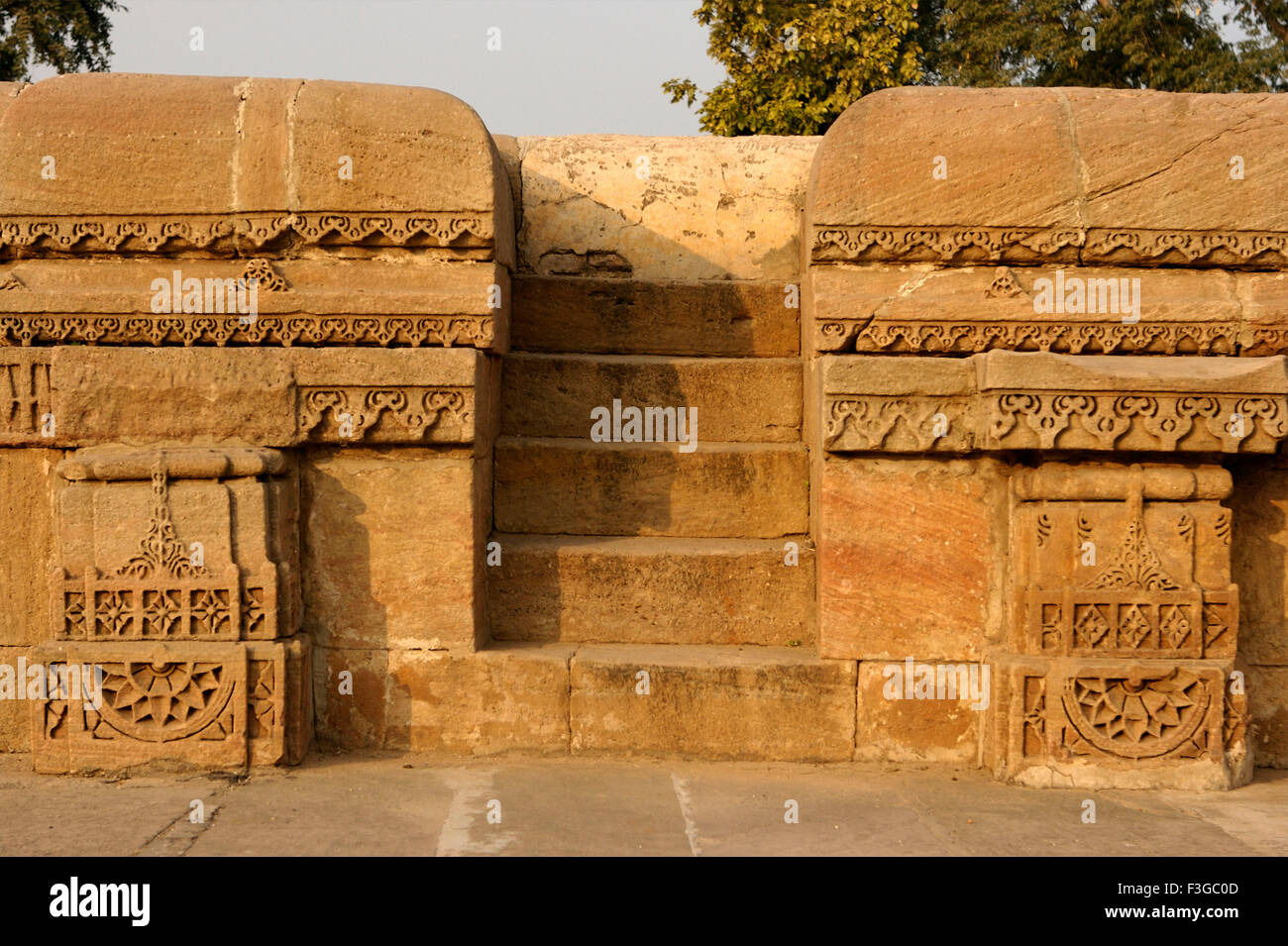 Steps at Carved panels on walls of Adalaj Vava step well built by Queen ...