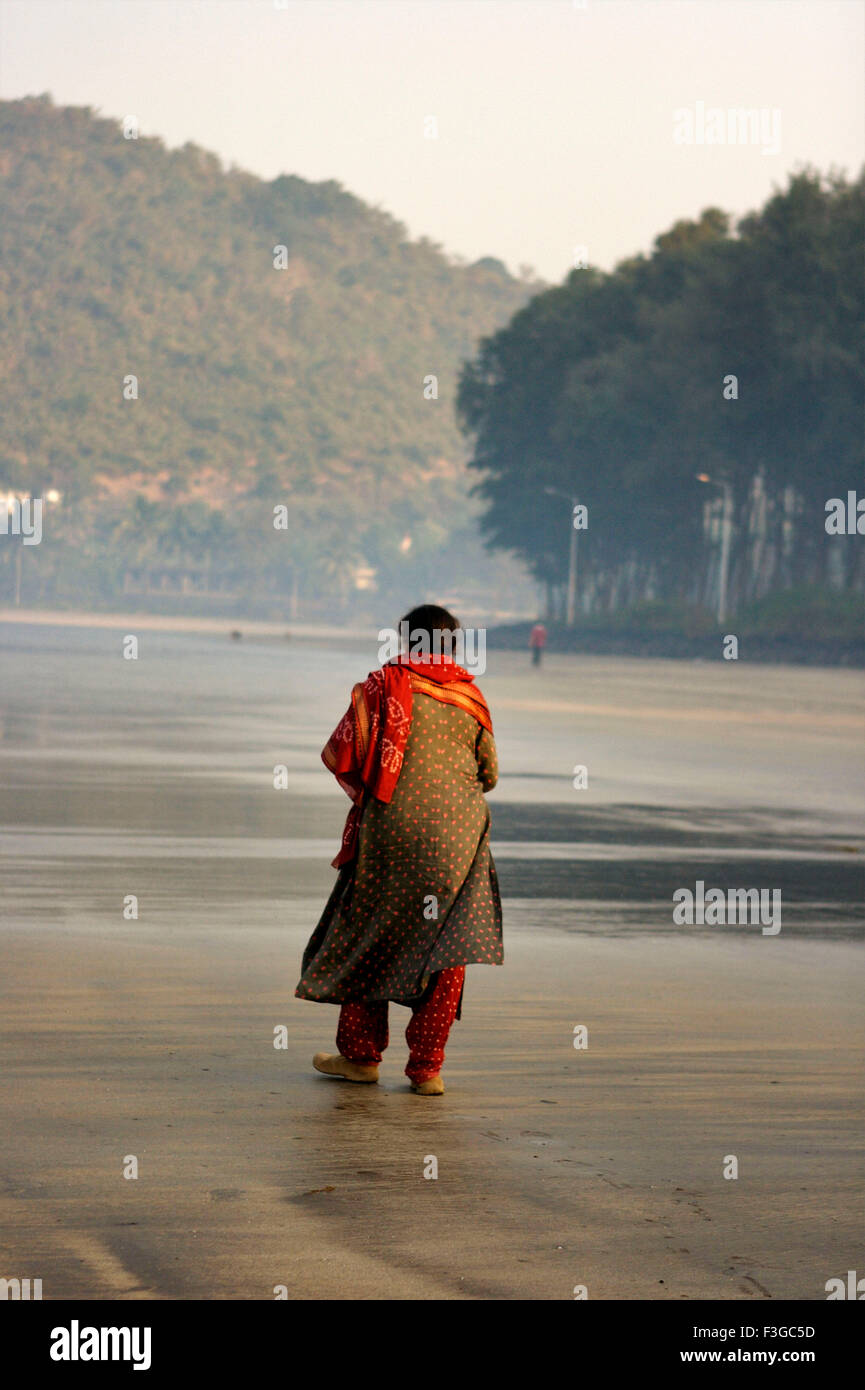Lady alone at Murud Janjira coast ; District Raigad ; Maharashtra ...