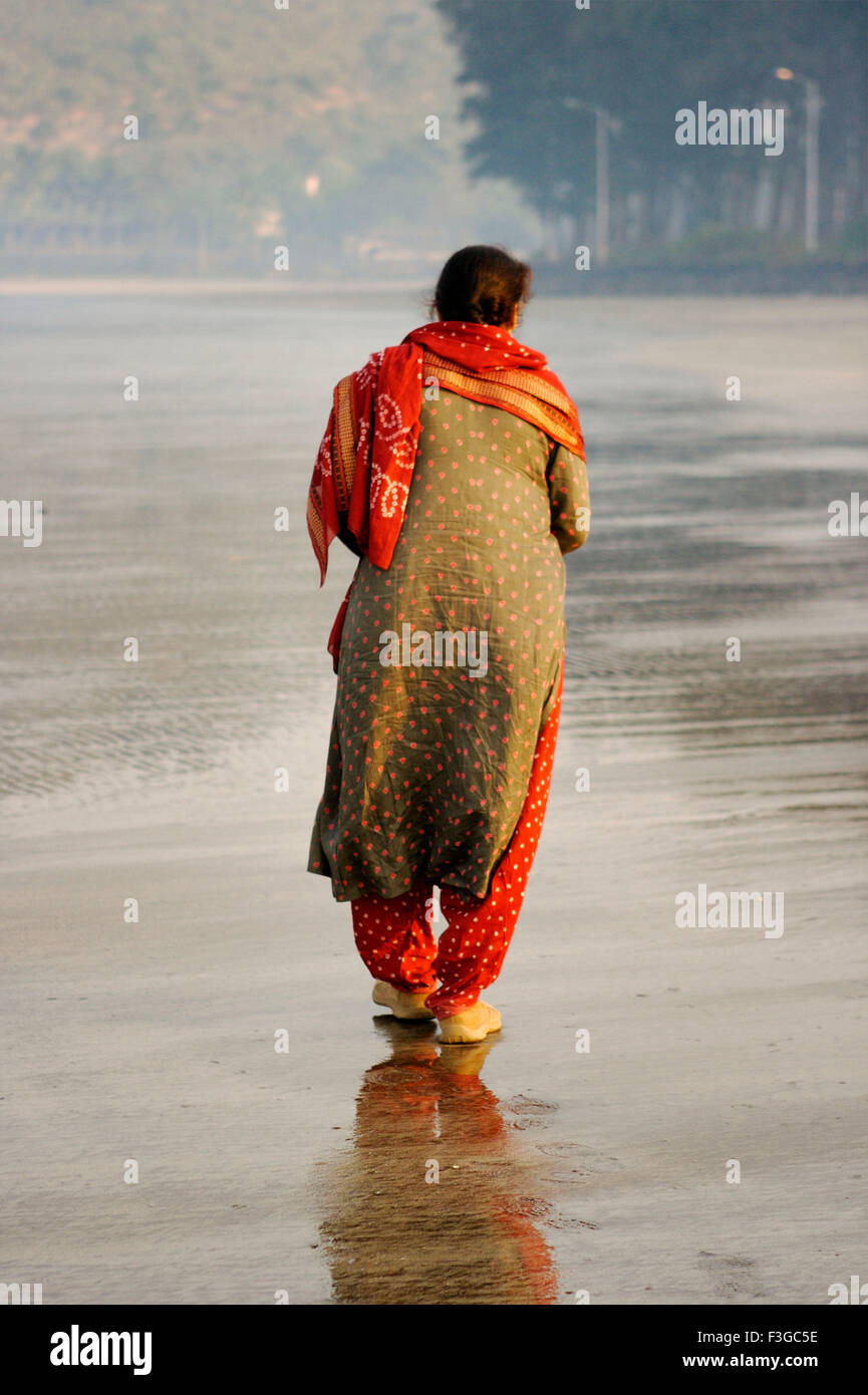 Lady alone at Murud Janjira coast ; District Raigad ; Maharashtra ...