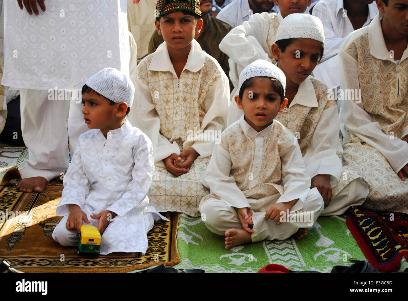 Children sitting namaz on id ul fitr on ramzan id hi-res stock ...