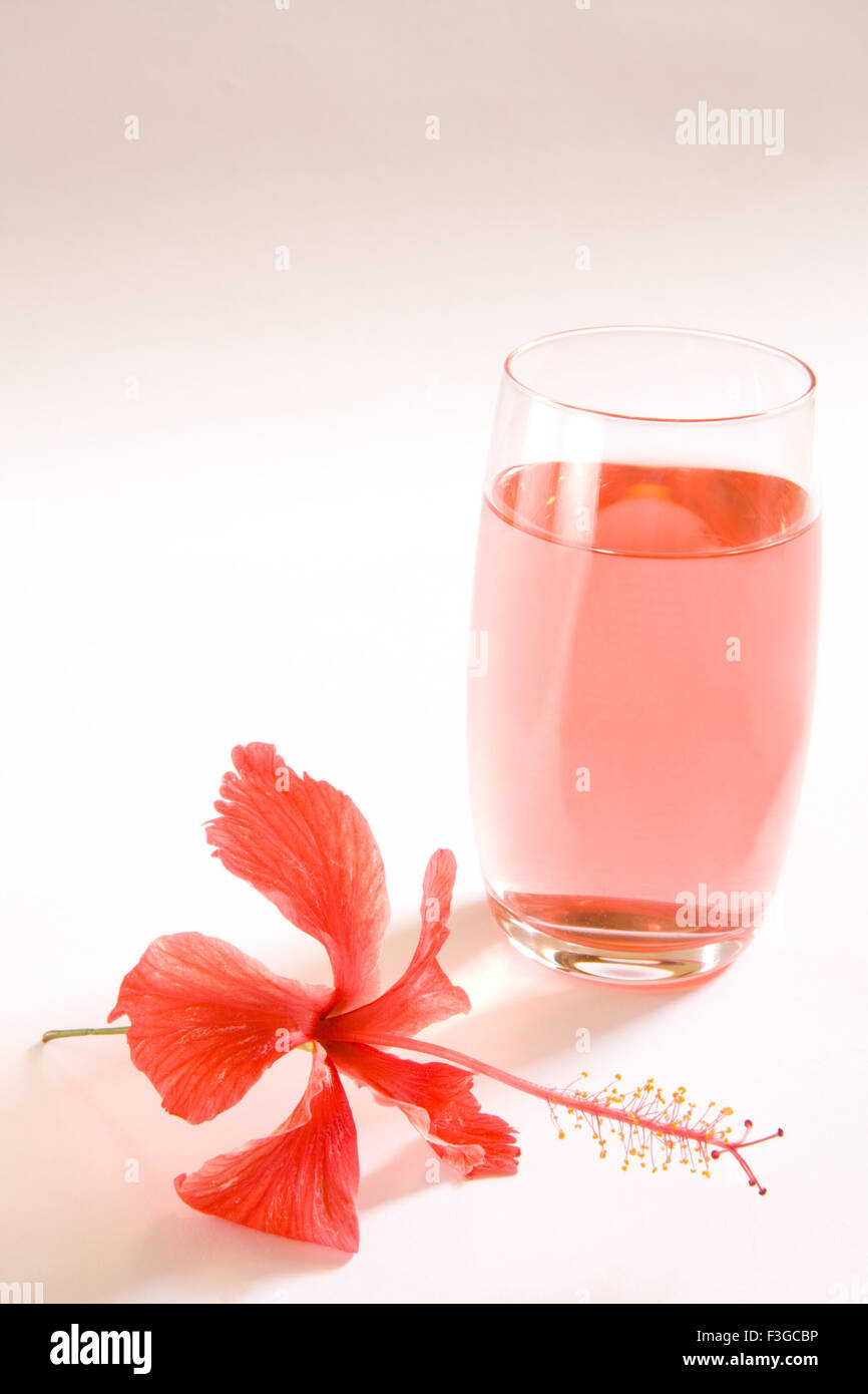 Shoe flower hibiscus juice in glass use in ayurvedic medicine help ...