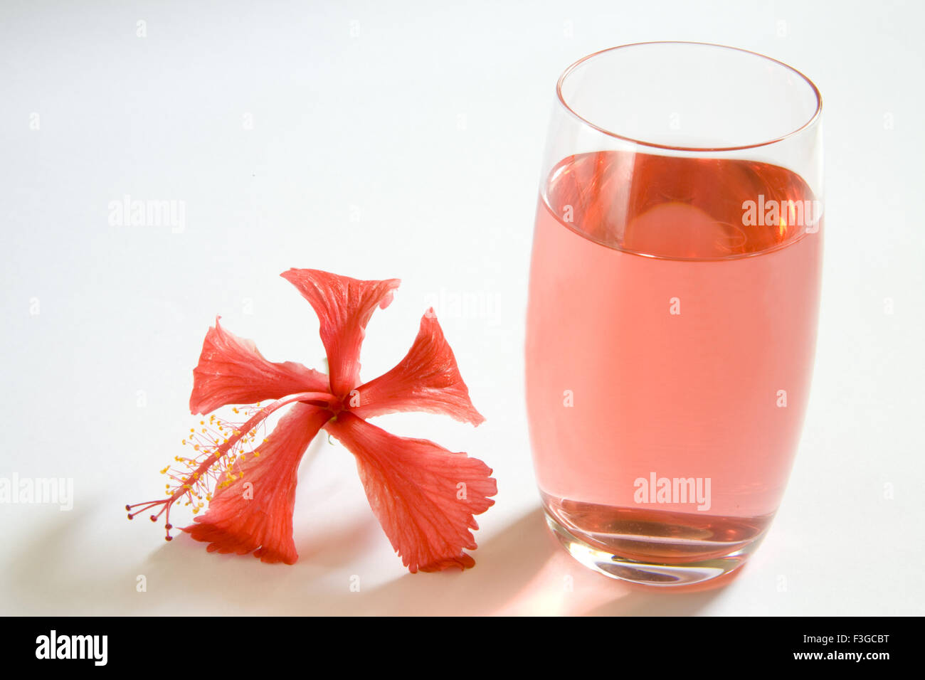 Shoe flower hibiscus juice in glass use in ayurvedic medicine help ...