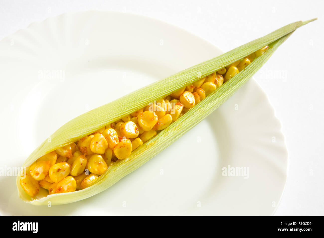 Food grain vegetable corn maize sweet and spicy in peel served in plate ...