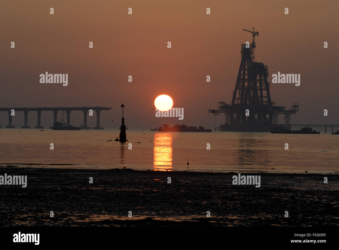 Sunset at Mahim Beach near Worli sea link bridge under construction ...
