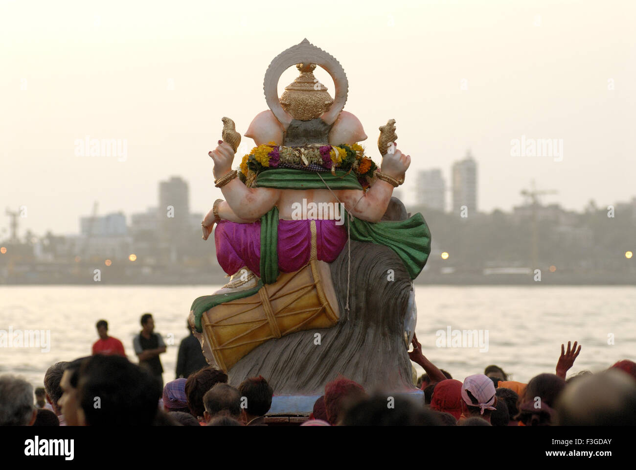 Back pose of Idol of lord Ganesh ganpati during immersion at Mahim ...