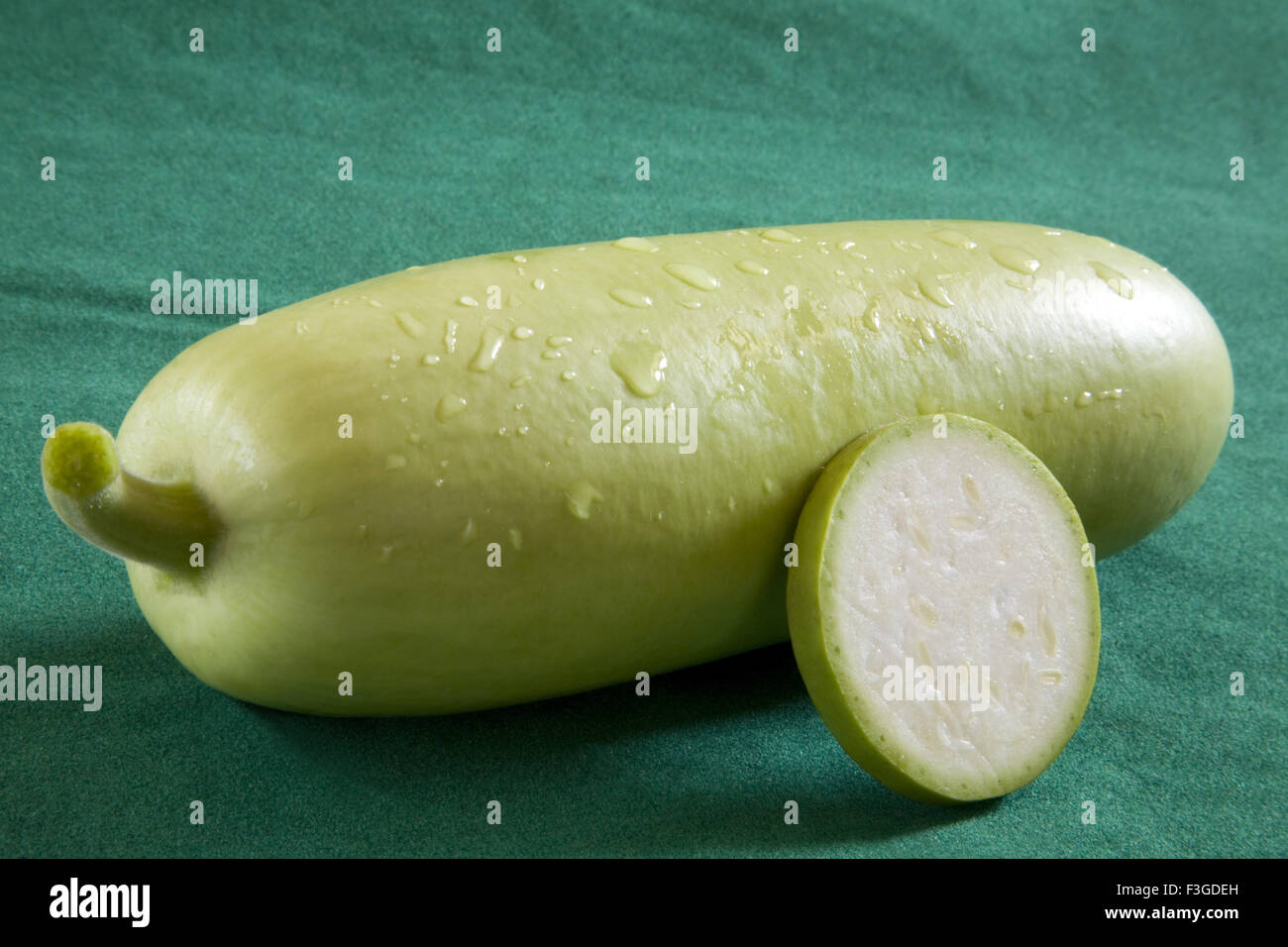 Full Green vegetable Bottle Gourd doodhi lauki with cut slice on green ...