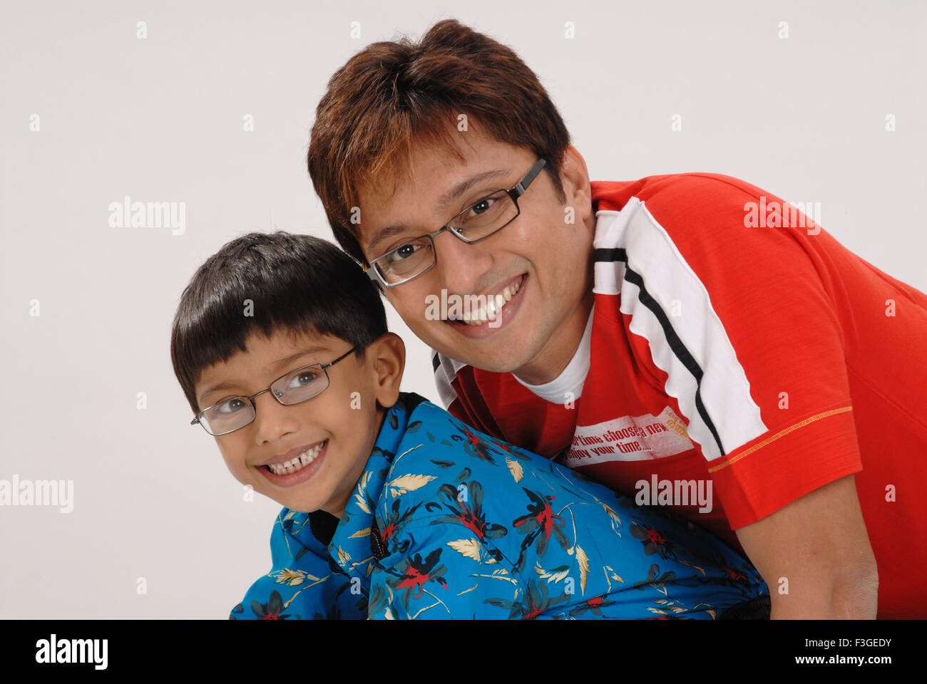 South Asian Indian father and son playing ; Bombay Mumbai ; Maharashtra ...