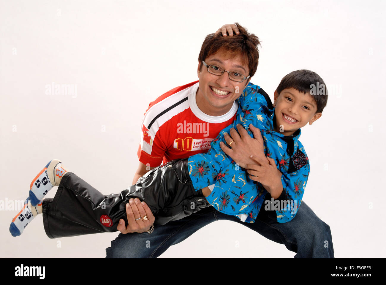 Indian father picking son asian man lifting child white background - MR ...