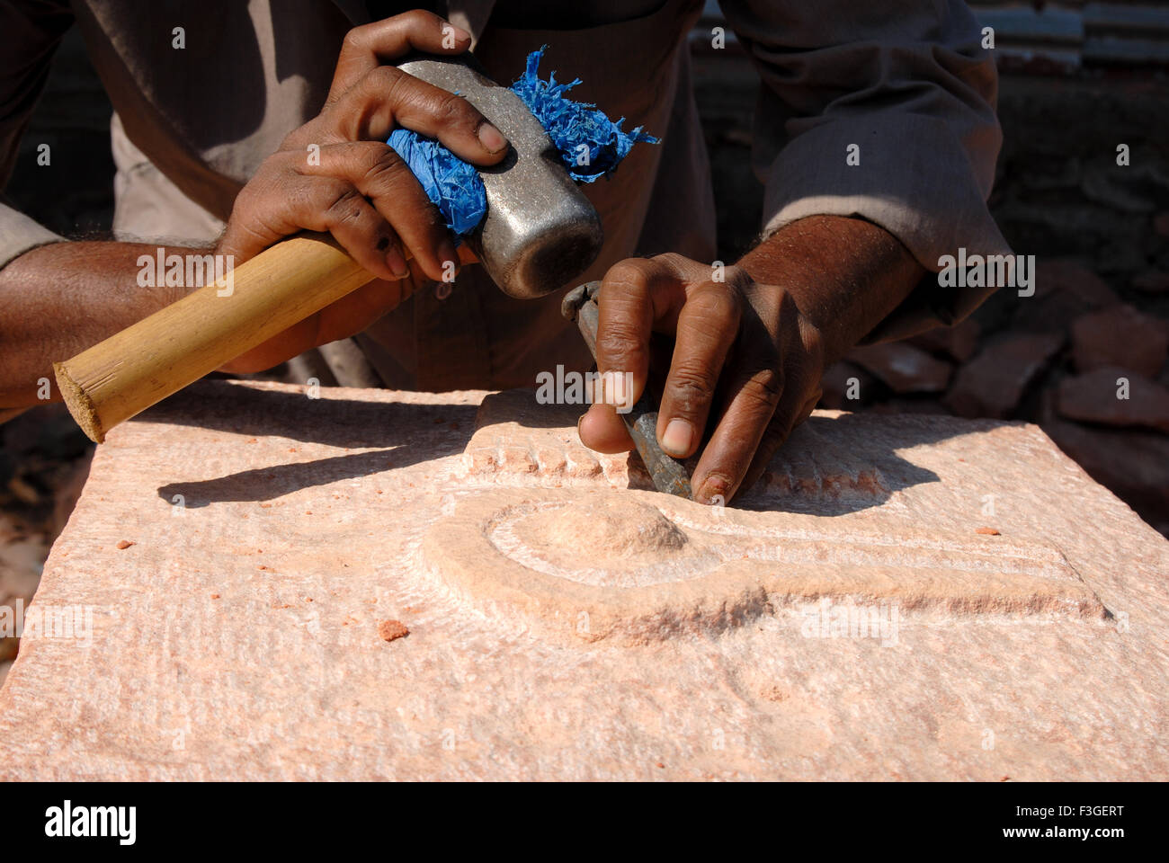 Sculpture ; man carving stone form of Shivling ; Chisser; Sangli ...