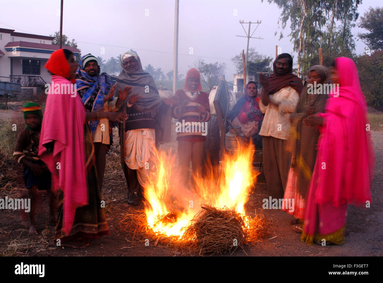 rural people warming themselves to protect from cold Sangli Maharashtra ...