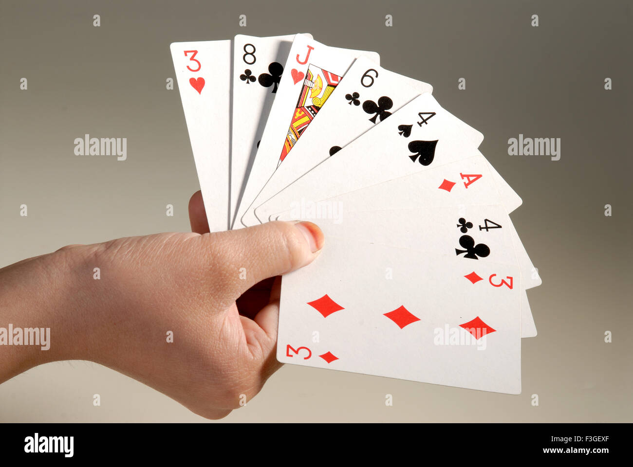 Playing card game showing hand holding eight cards MR#364 Stock Photo ...