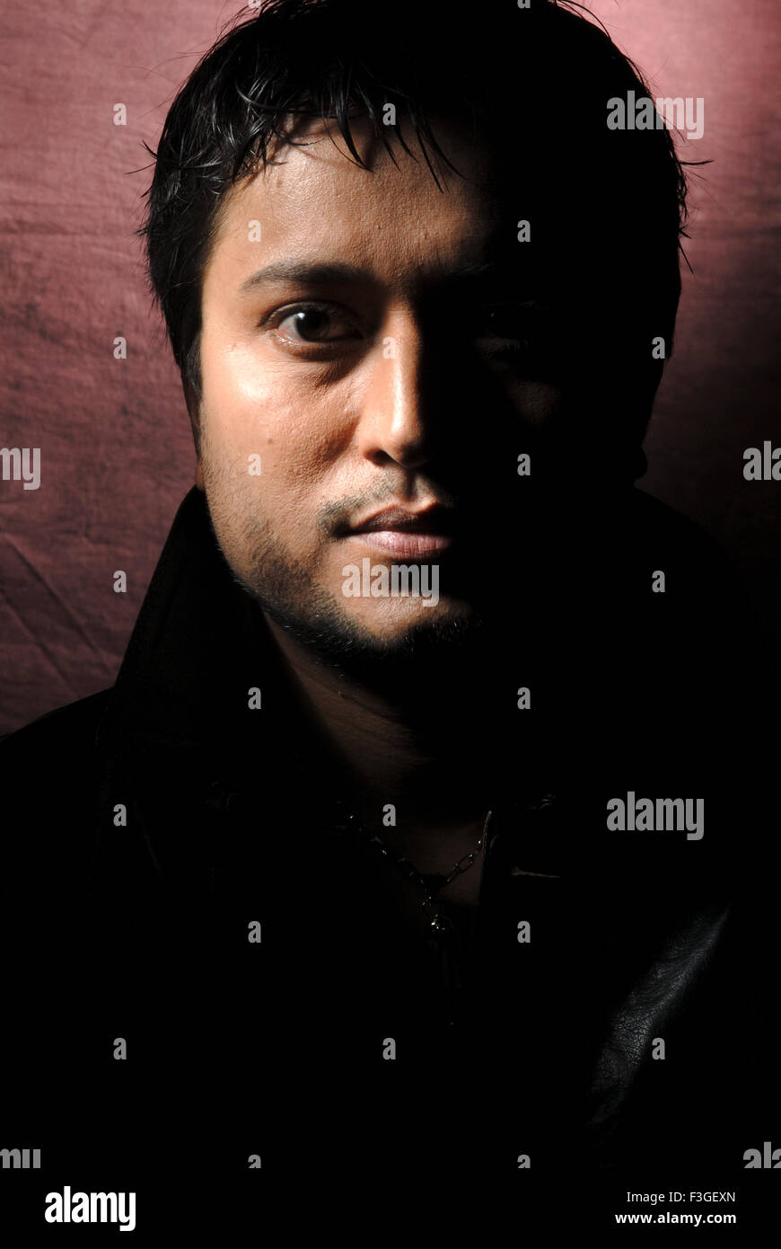 Indian man adult portrait confident intense looking at camera - brown ...