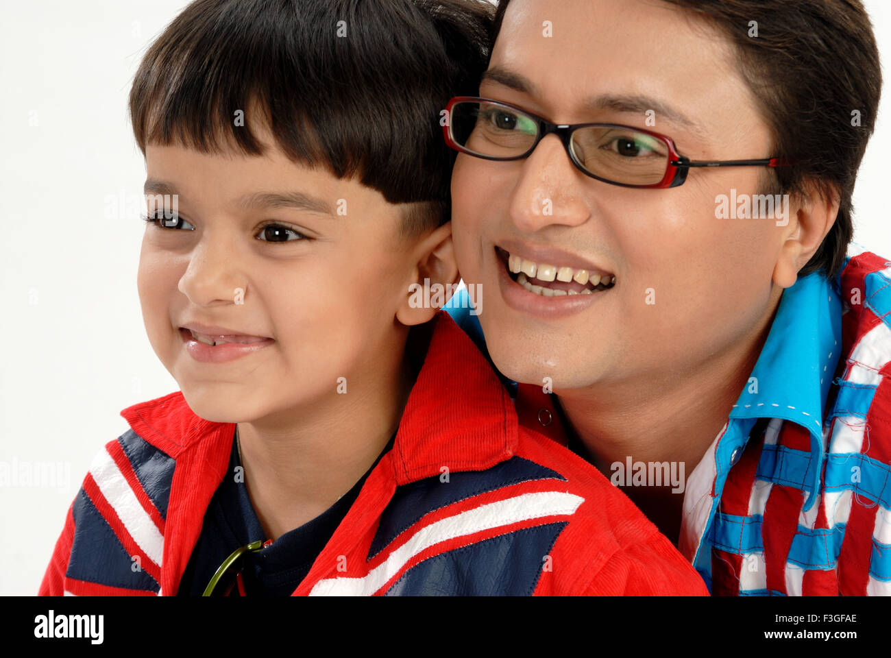 South Asian Indian father and son smiling and enjoying ; Bombay Mumbai ...