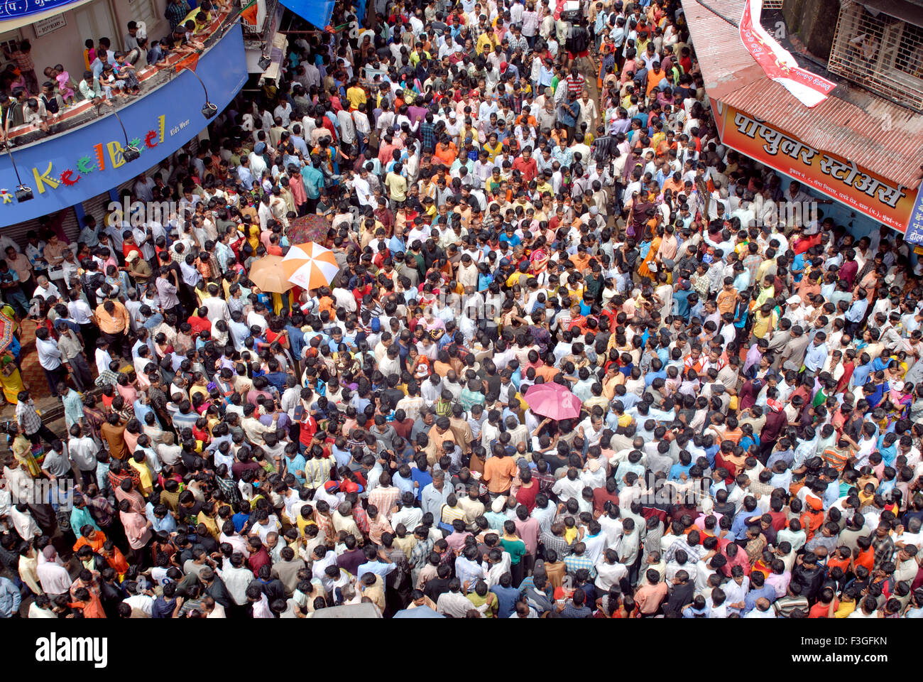 Crowded road ; people gathered to see dahi handi on Govinda Gokul ...